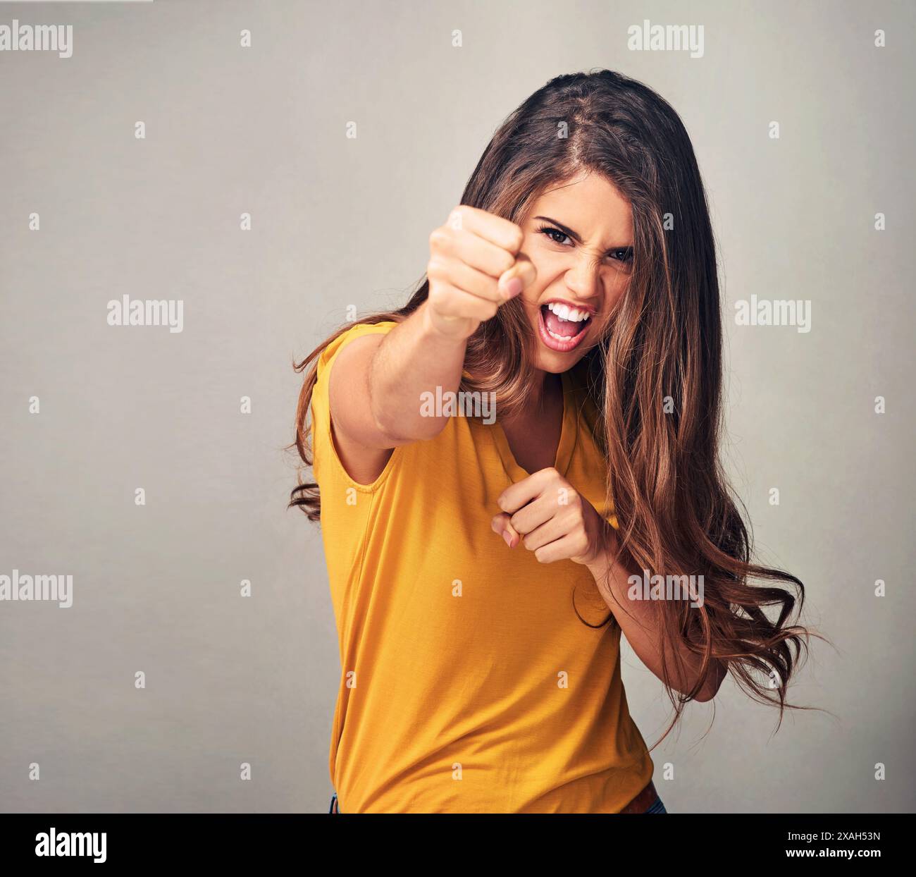 Fist, fight and portrait of woman in studio for equality, human rights ...