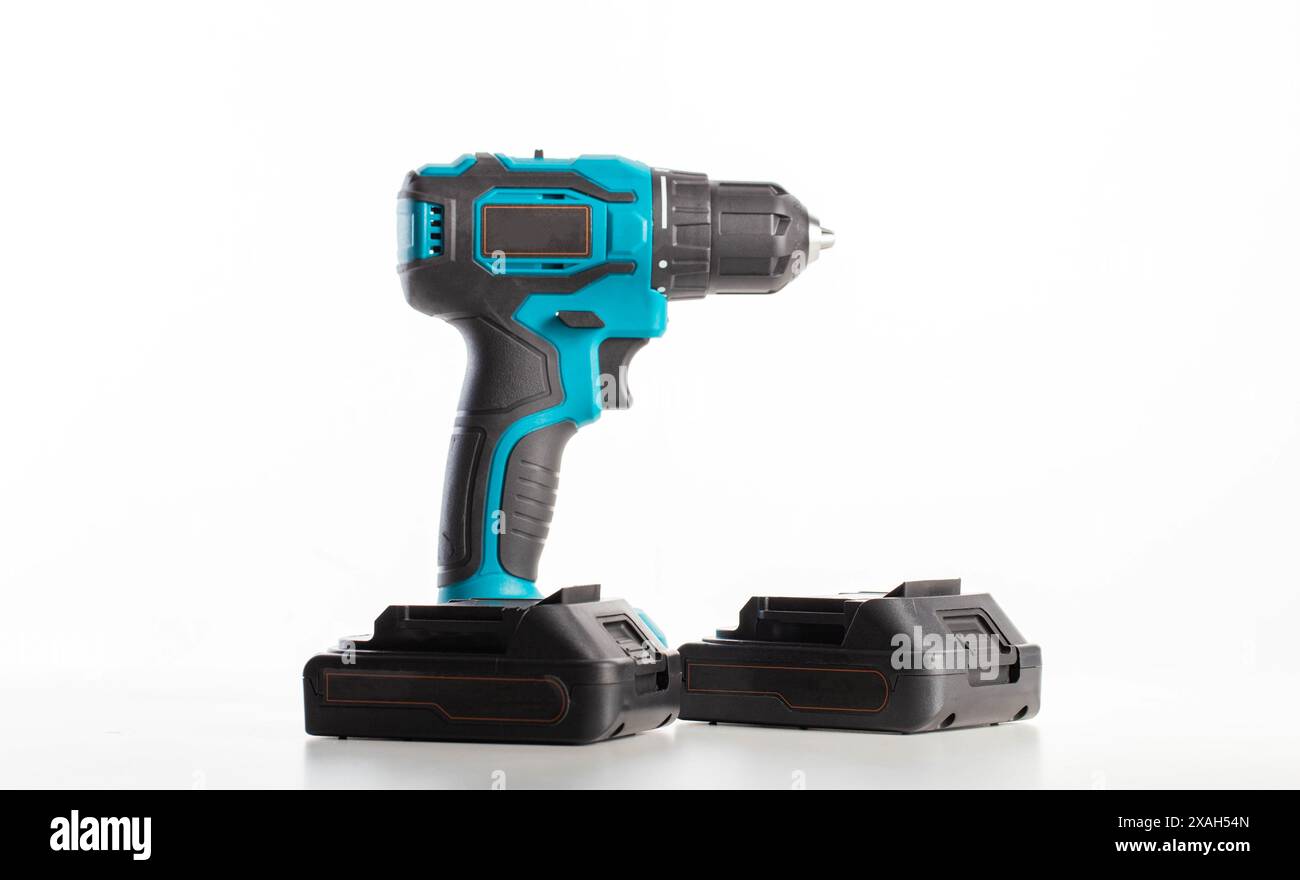 Modern drill and screwdriver with two batteries and a keyless chuck ...