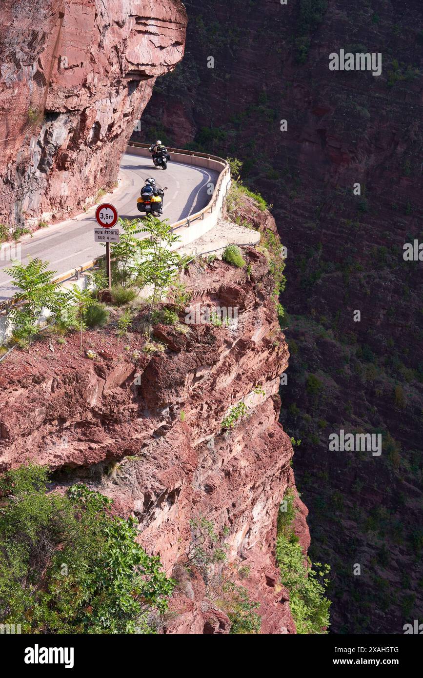 AERIAL VIEW from a 6-meter mast. Two motorcyclists on a scenic byway ...