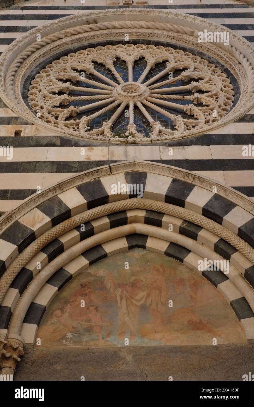 Striped facade of The Church Of Saint John The Baptist, Lunette fresco ...