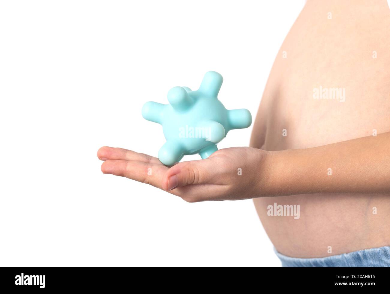 The girl holds a model of the virus against the background of her ...