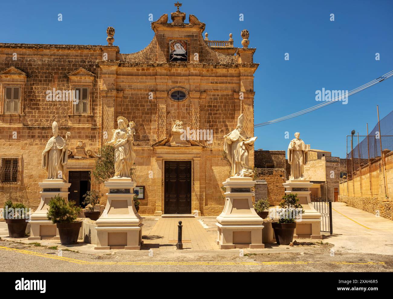 Statues flank the entrance to the historic Saint Augustine convent in ...