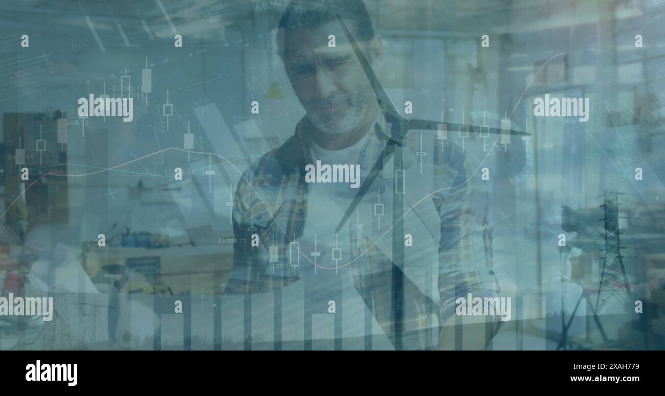 Image of graphs and financial data over wind turbine and caucasian male ...
