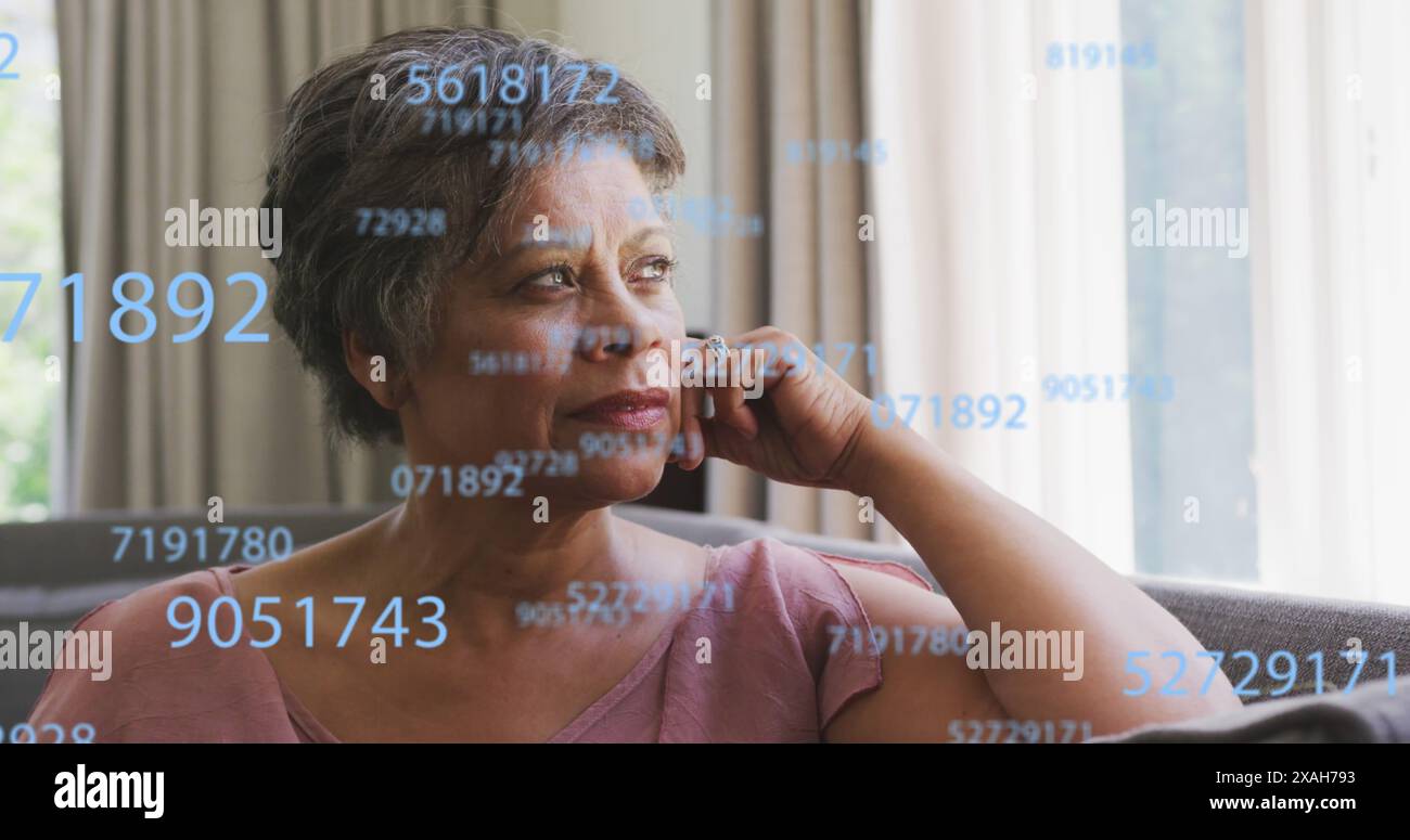 Image of numbers over senior african american woman Stock Photo - Alamy