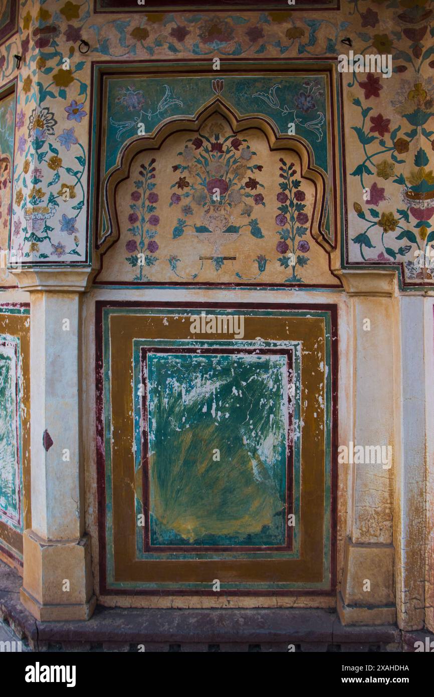 Colorful flower patterns are painted on the courtyard wall of the Amer ...