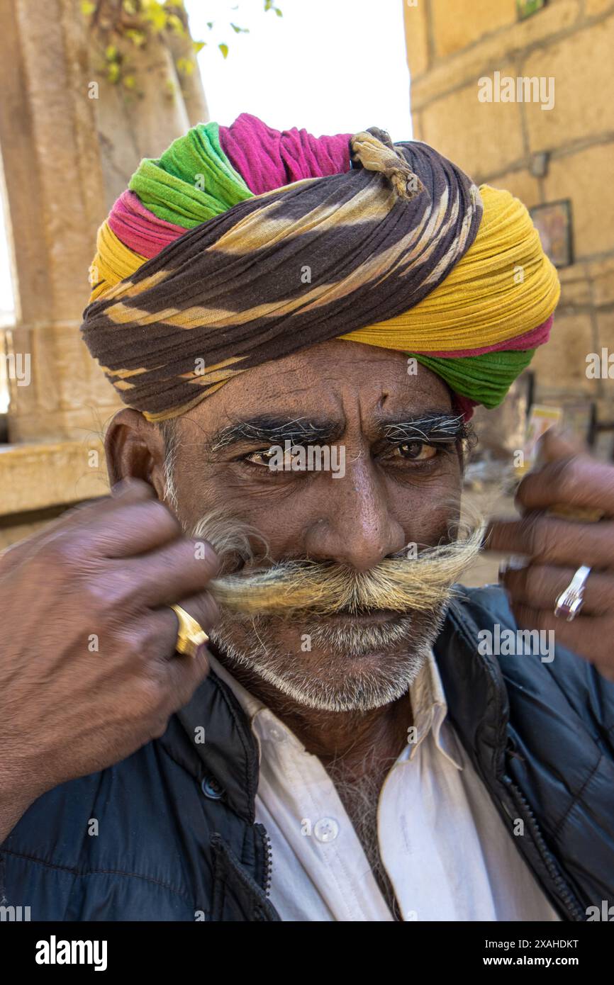 The folk Singer of Jaisalmer playing Harmonium asks for visitors' names ...
