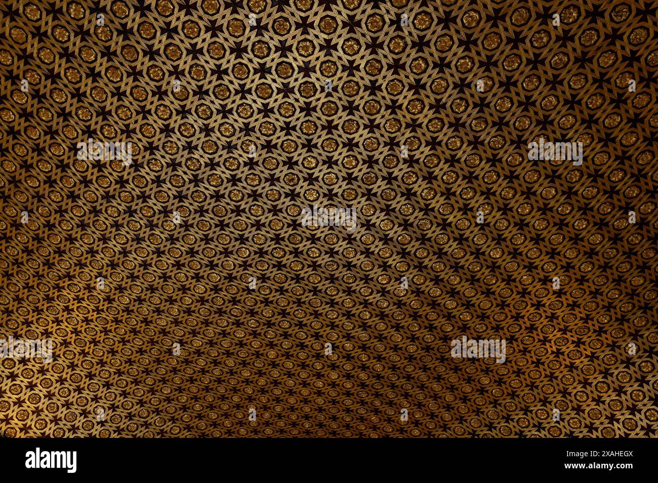 Ornate wooden ceiling with a detailed, repetitive pattern and golden ...