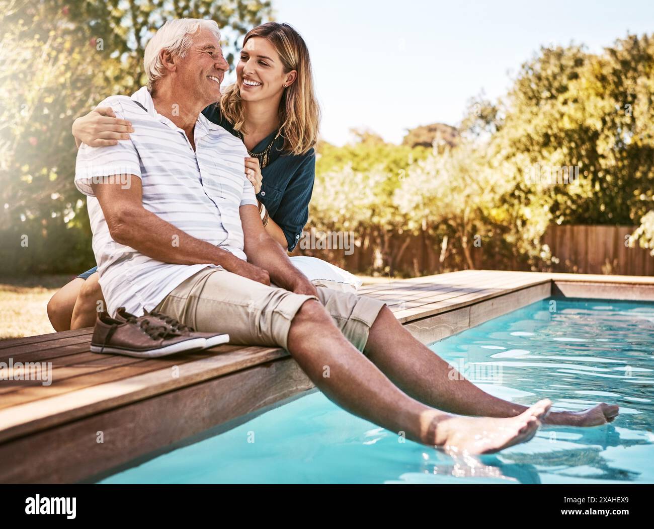 Father, daughter or happiness by swimming pool for bonding, hug or ...