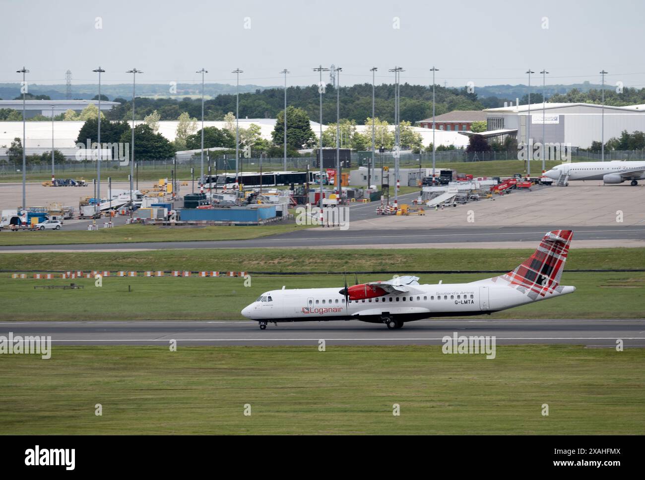Loganair ATR 72-600 landing at Birmingham Airport, UK (G-LMTA Stock ...