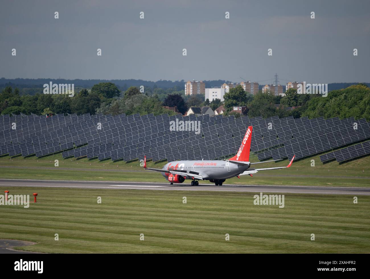 Jet2 aircraft landed at Birmingham Airport with solar panels behind it ...