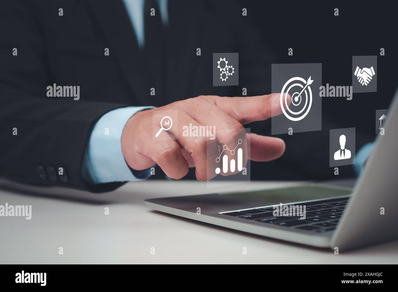 Businessman pointing finger at business target icon, Targeting the ...