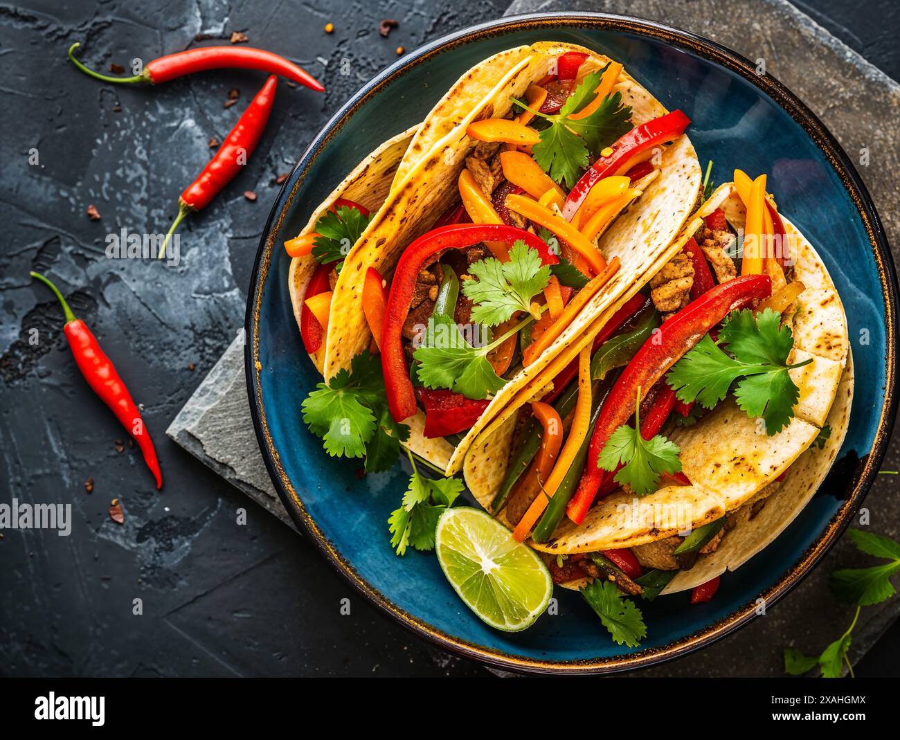 Photo of Tacos al Pastor food on dark slate background Stock Photo - Alamy
