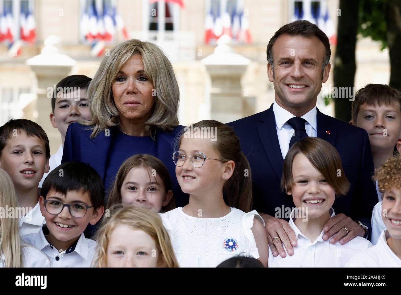 French President Emmanuel Macron and his wife Brigitte Macron pose with ...