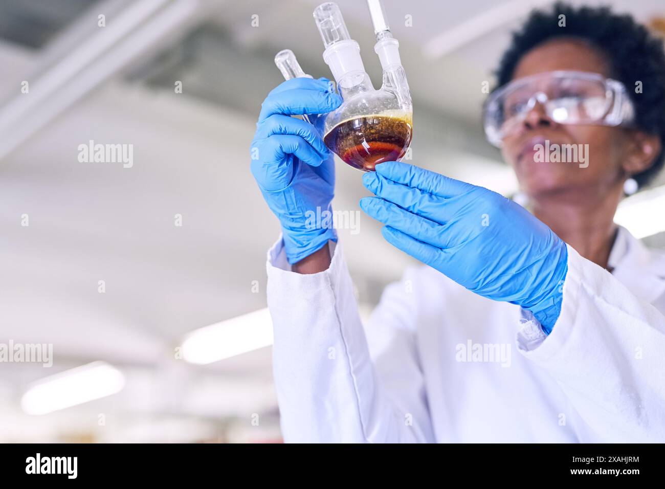 Black woman, scientist and chemical or solution in lab, experiment and ...
