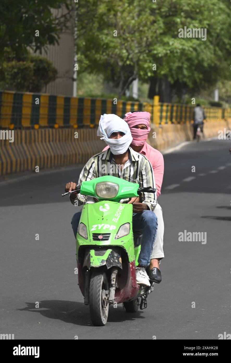 NOIDA, INDIA - JUNE 5: Visitors brave the heat Wave during a hot summer ...
