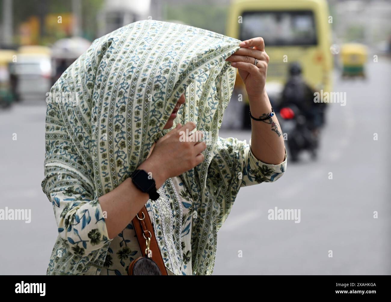 NOIDA, INDIA - JUNE 5: Visitors brave the heat Wave during a hot summer ...