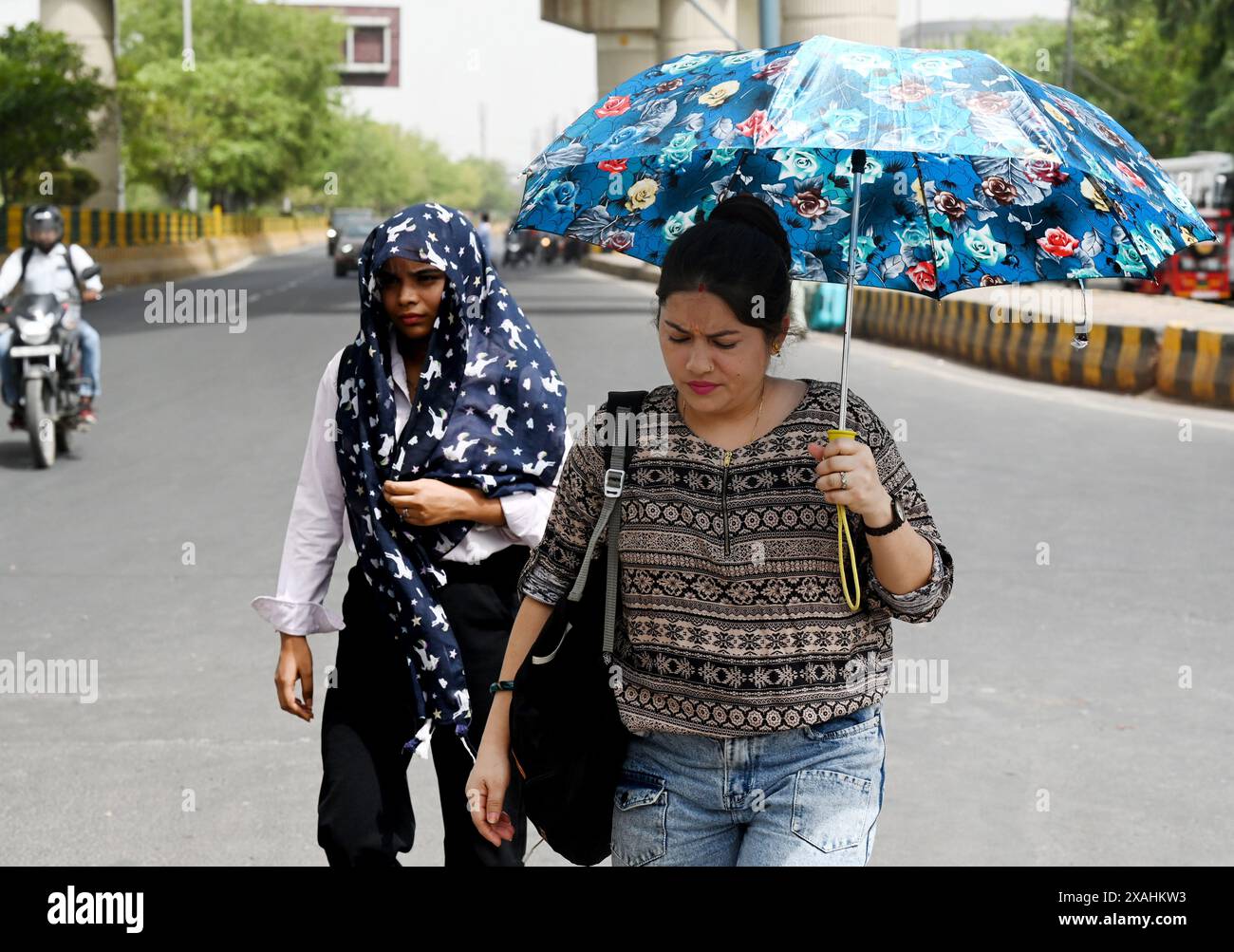 NOIDA, INDIA - JUNE 5: Visitors brave the heat Wave during a hot summer ...