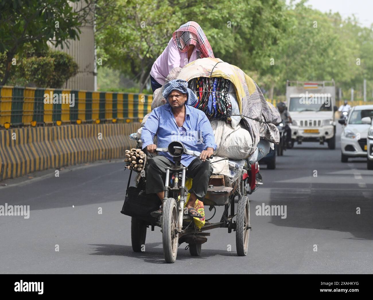 NOIDA, INDIA - JUNE 5: Visitors brave the heat Wave during a hot summer ...