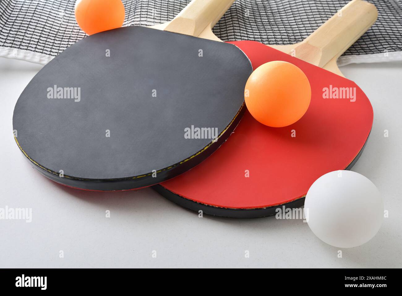 Background with set of table tennis paddles, net and orange ball ...