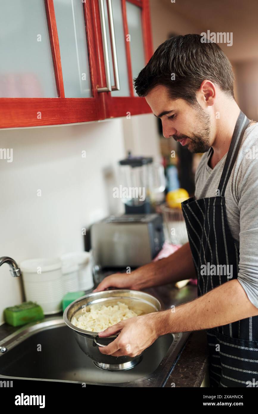 Man, pot and cooking food in home for dinner or eating on kitchen ...