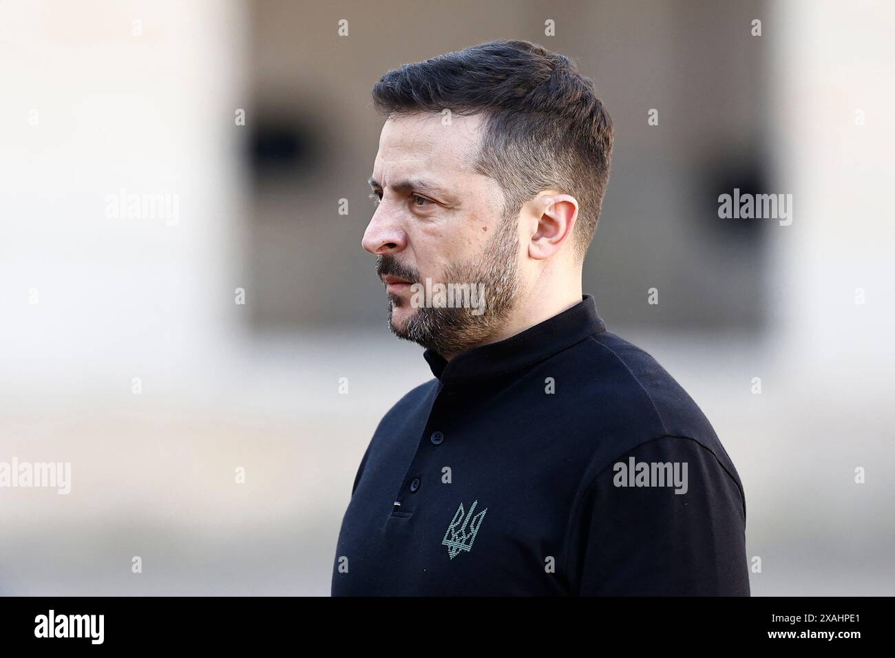 Ukraine's President Volodymyr Zelensky looks on after a military honour ...