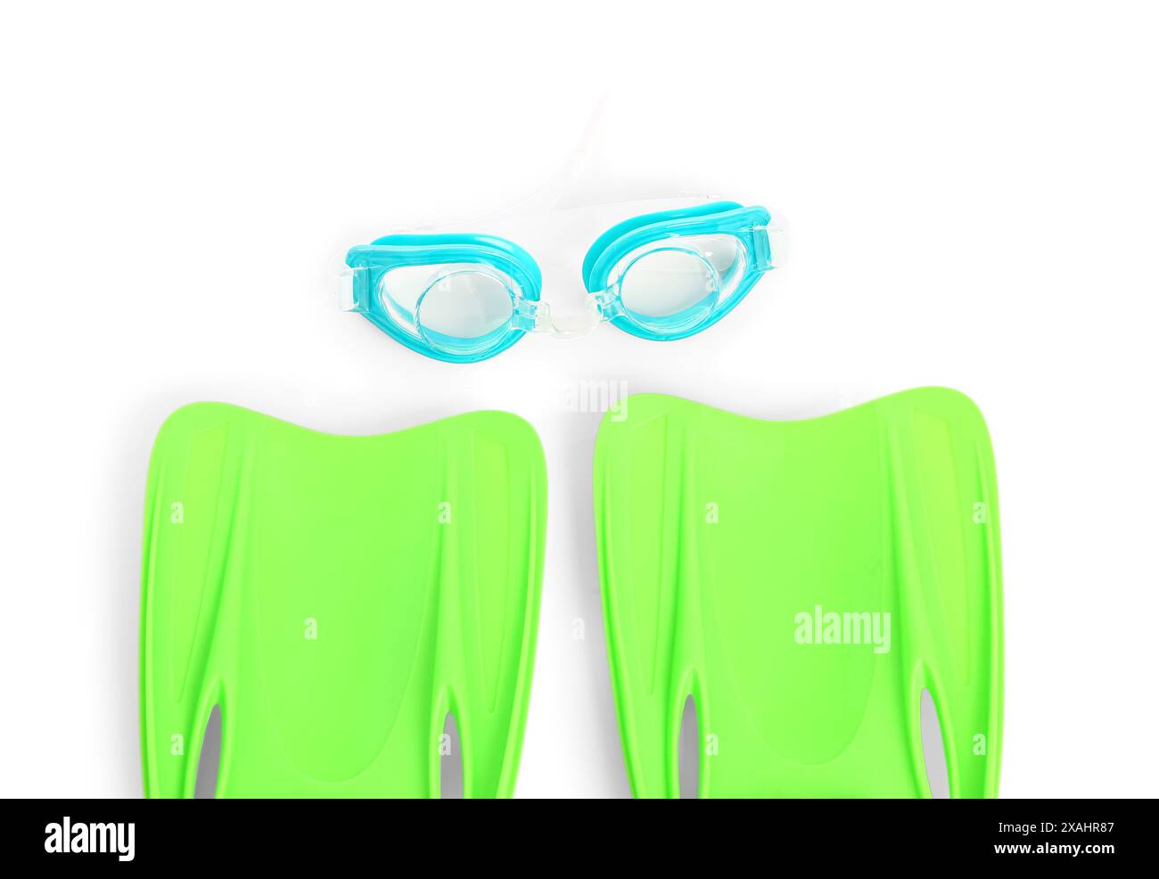 New swimming goggles and flippers on white background Stock Photo - Alamy