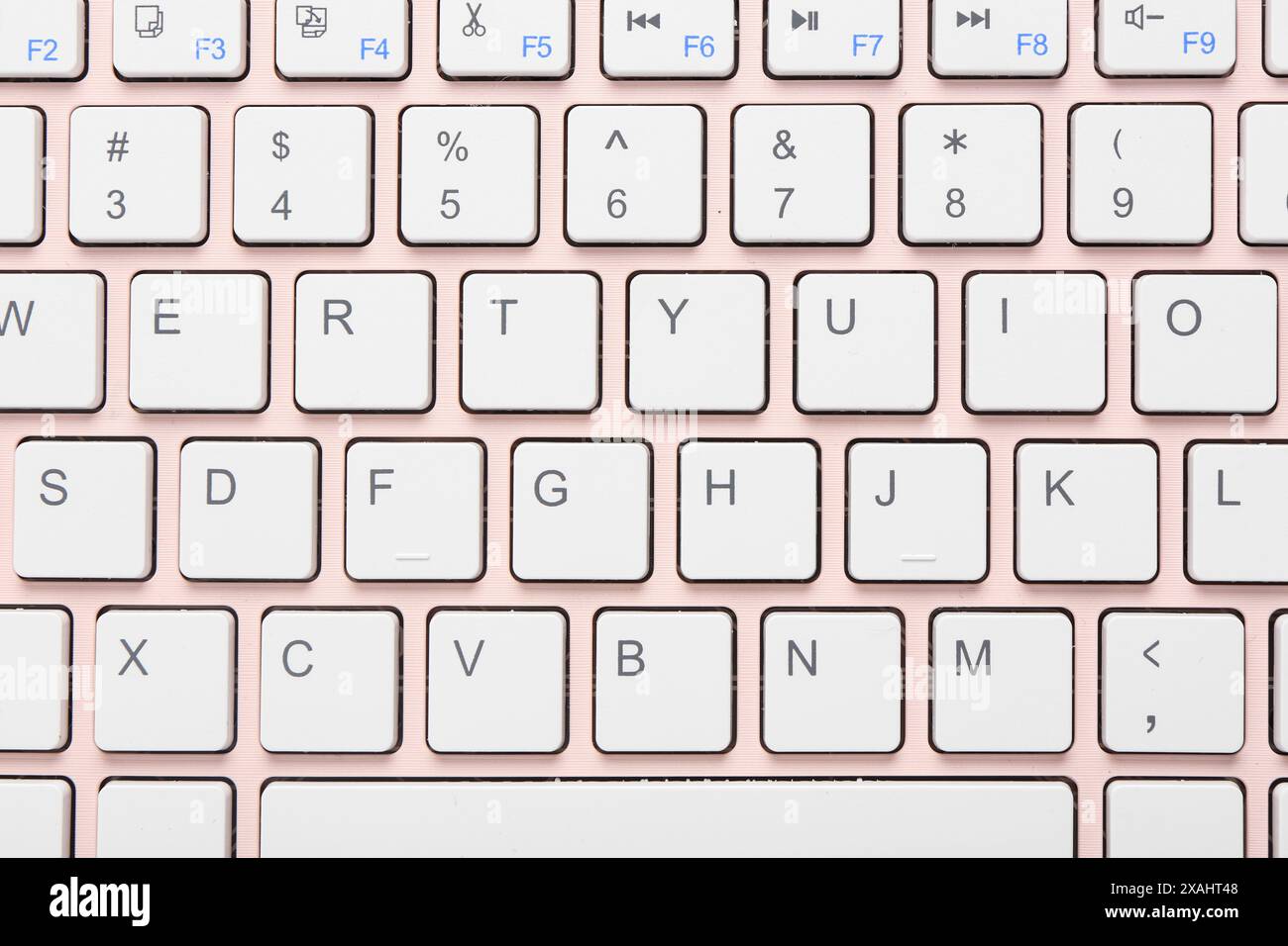 Modern pink computer keyboard, closeup Stock Photo - Alamy