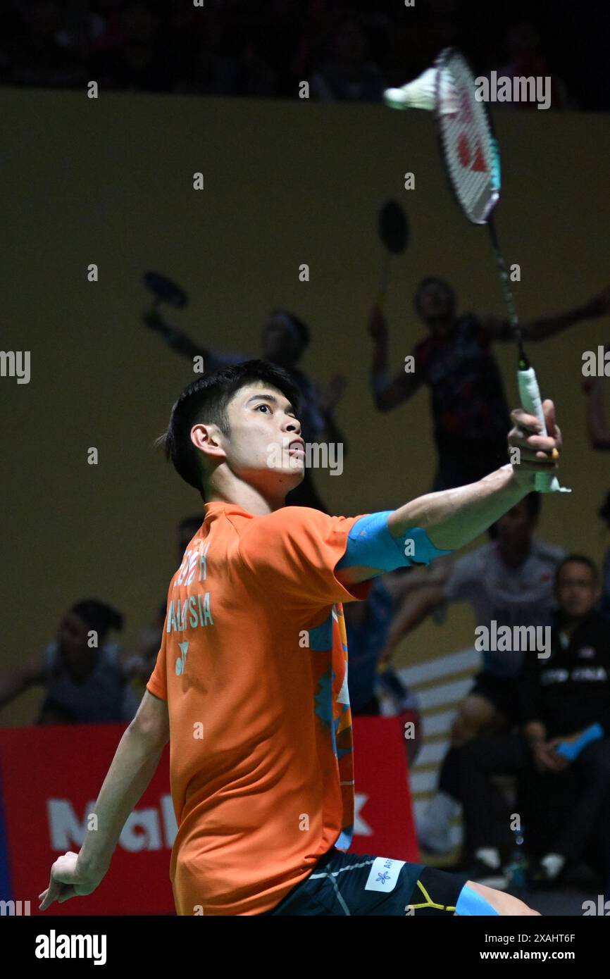 JAKATAR, June 7, 2024 (Xinhua) -- Leong Jun Hao hits a return during ...