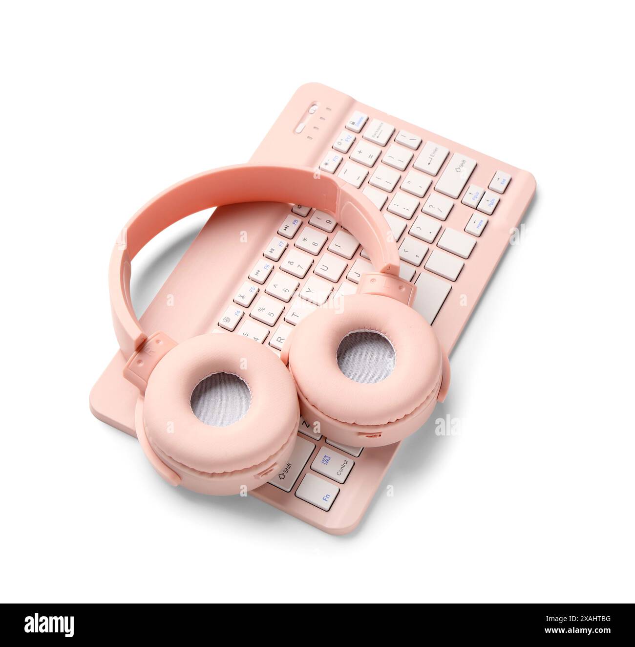 Modern headphones on keyboard Cut Out Stock Images & Pictures - Alamy