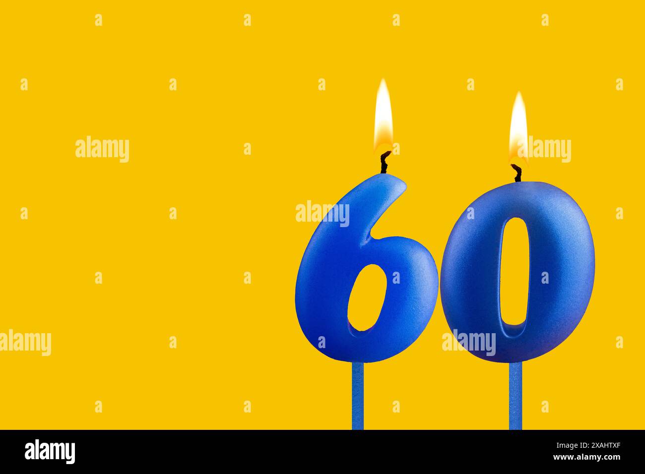 Blue candle number 60 - Birthday on yellow background Stock Photo - Alamy