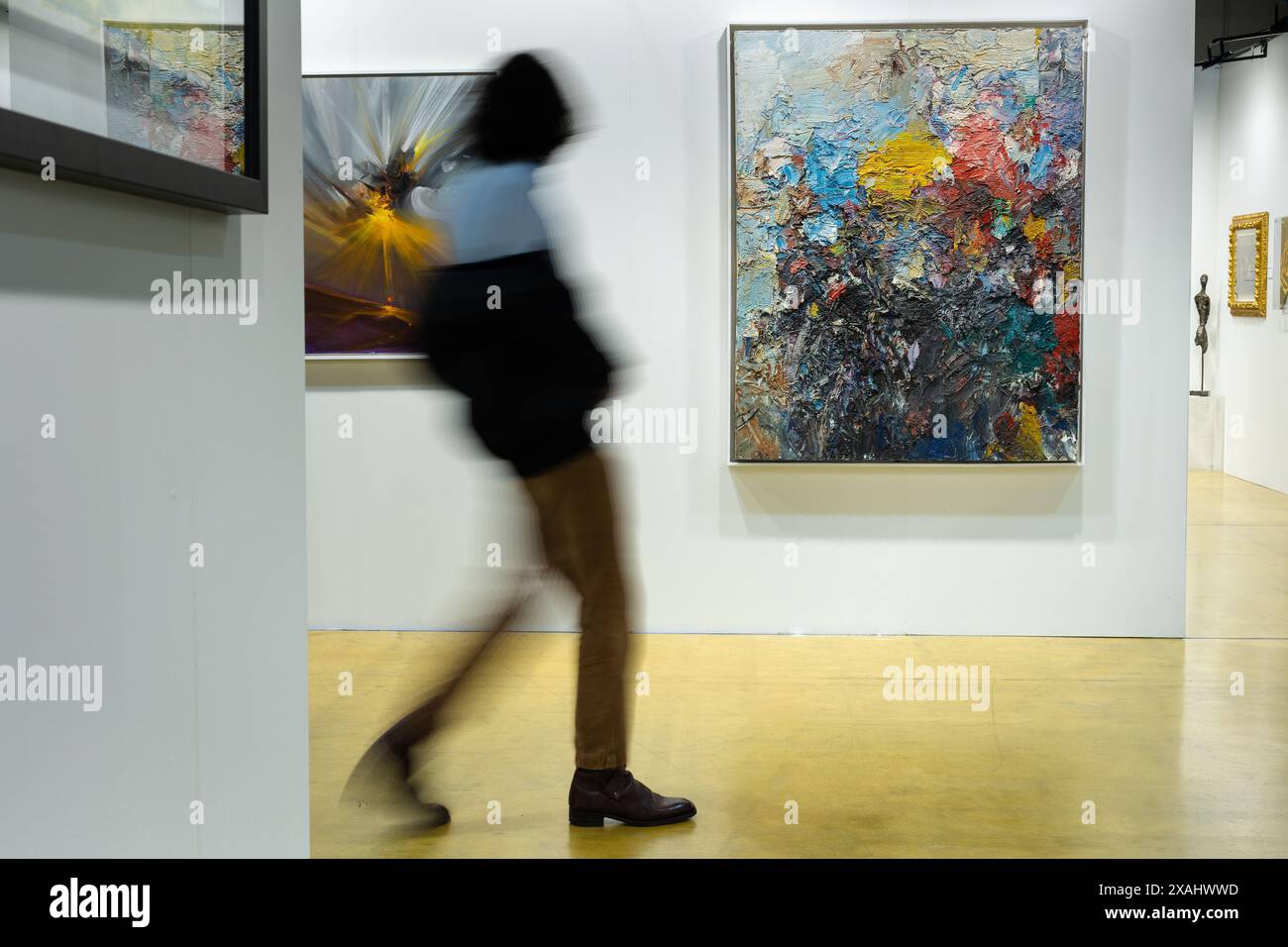 People Walking and Admiring Paintings in a Modern Art Gallery Stock ...