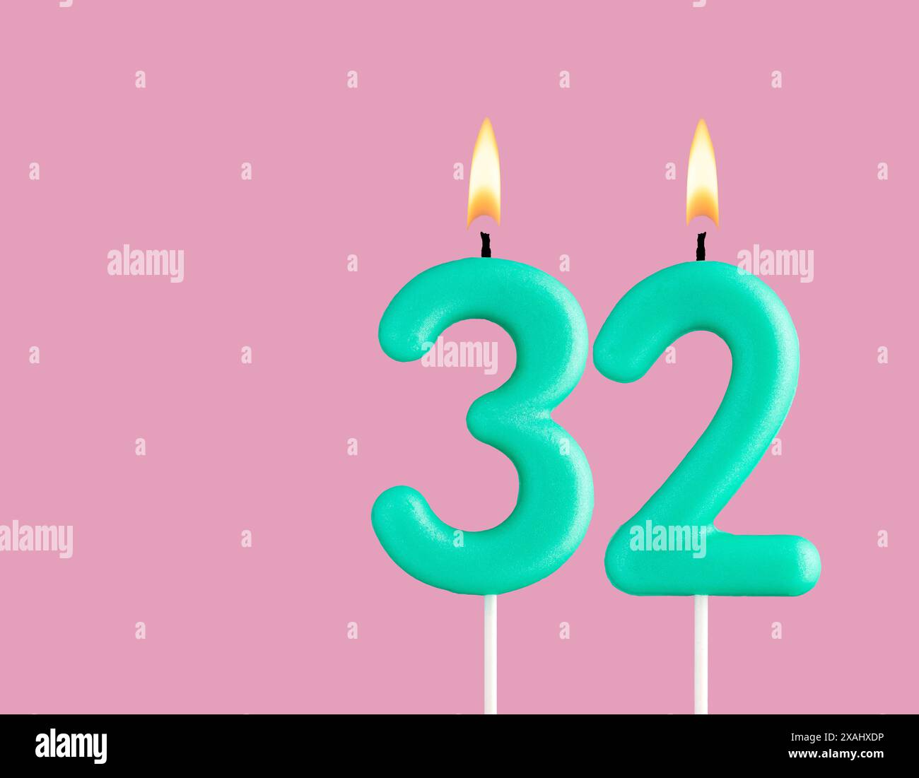 Green candle number 32 - Birthday card on pastel pink background Stock ...