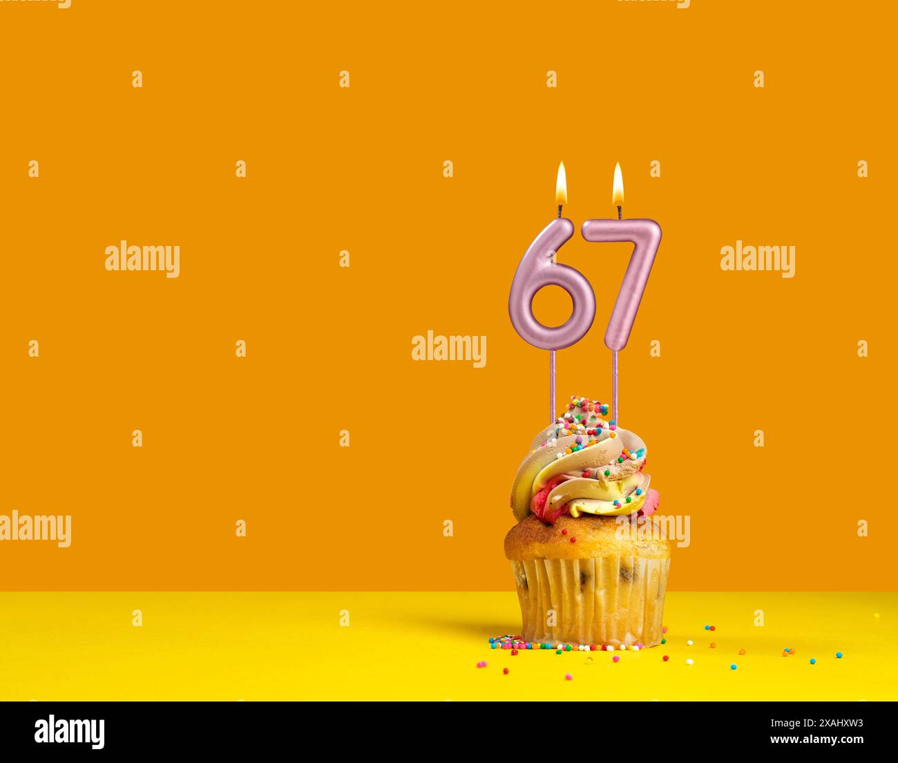 Birthday celebration with cupcake - Candle number 67 Stock Photo - Alamy