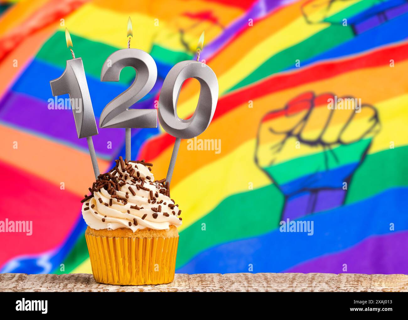 Birthday candle number 120 - Gay march flag background Stock Photo - Alamy