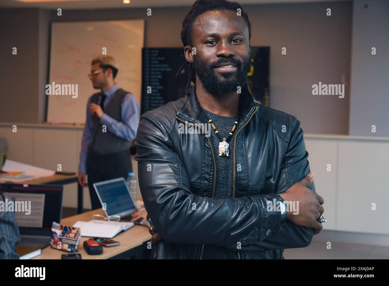 Portrait of Young African Corporate Man with dreadlocks and beard with ...