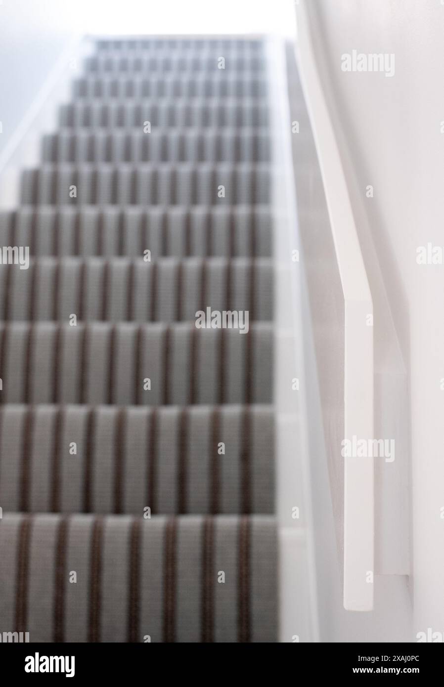 Minimalist, white painted MDF handrail banister, grey and tan striped ...