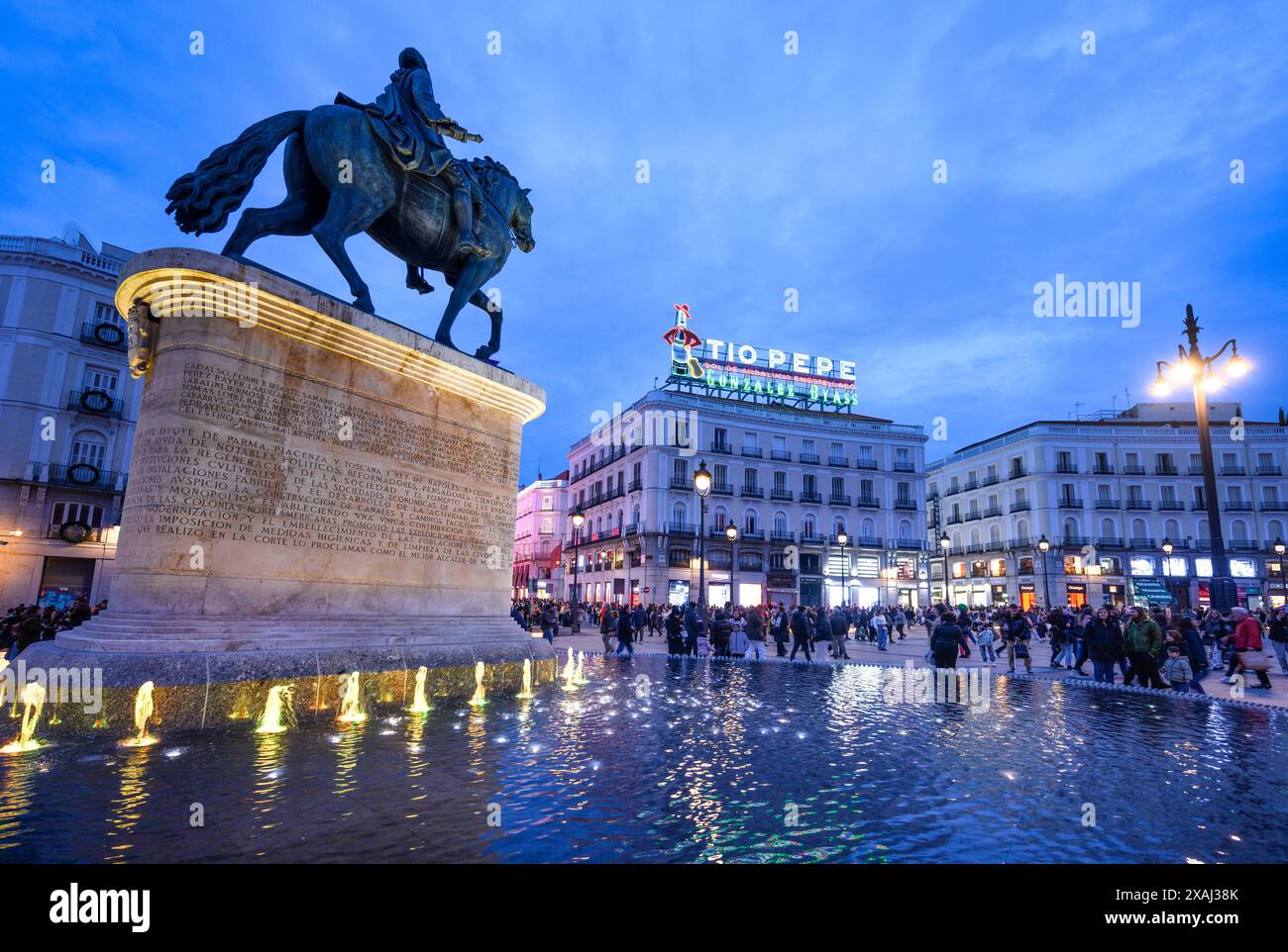 The statue of King Carlos III with the famous Tio Pepe advertising sign ...