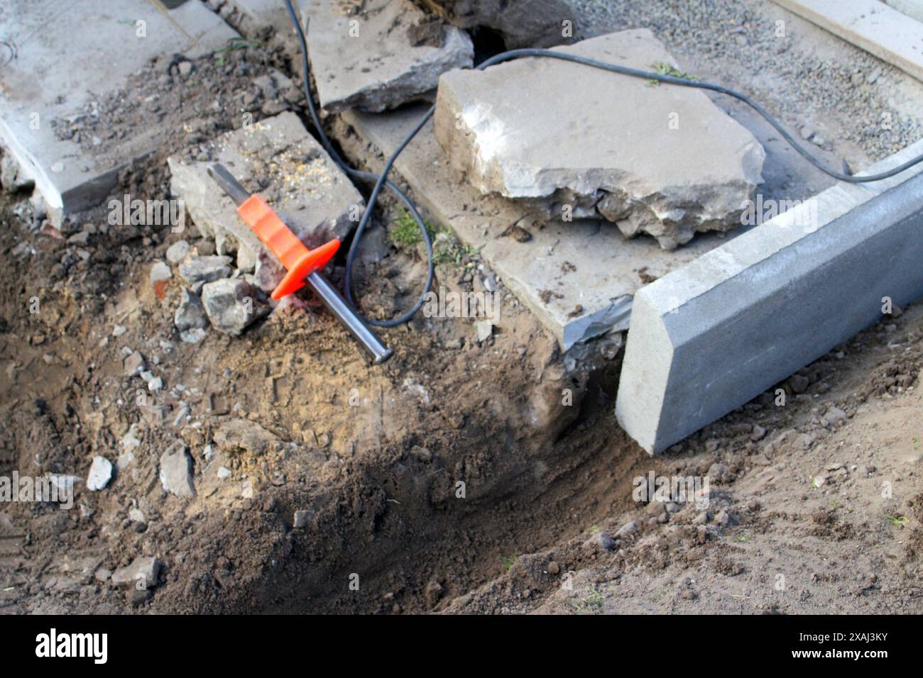 Slab paving process with chisel and angle grinder. Earth dig for slab ...