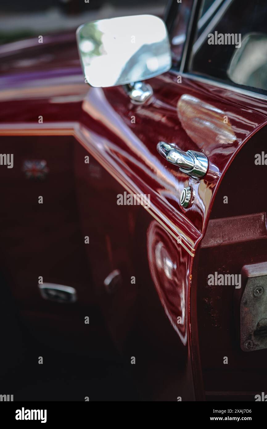 Red old car Jaguar on road in town between buildings Stock Photo - Alamy