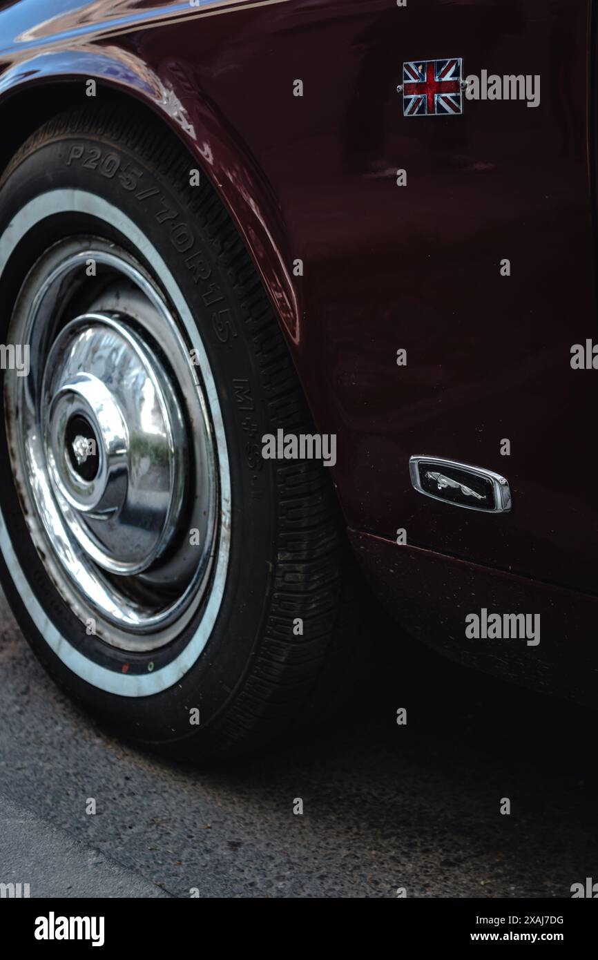 Red old car Jaguar on road in town between buildings Stock Photo - Alamy