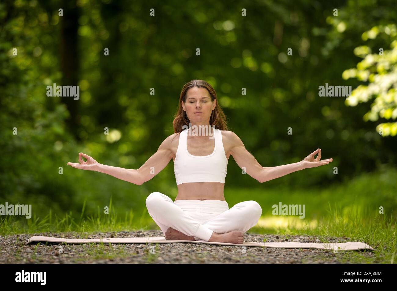 Woman eyes closed in meditation hi-res stock photography and images - Alamy