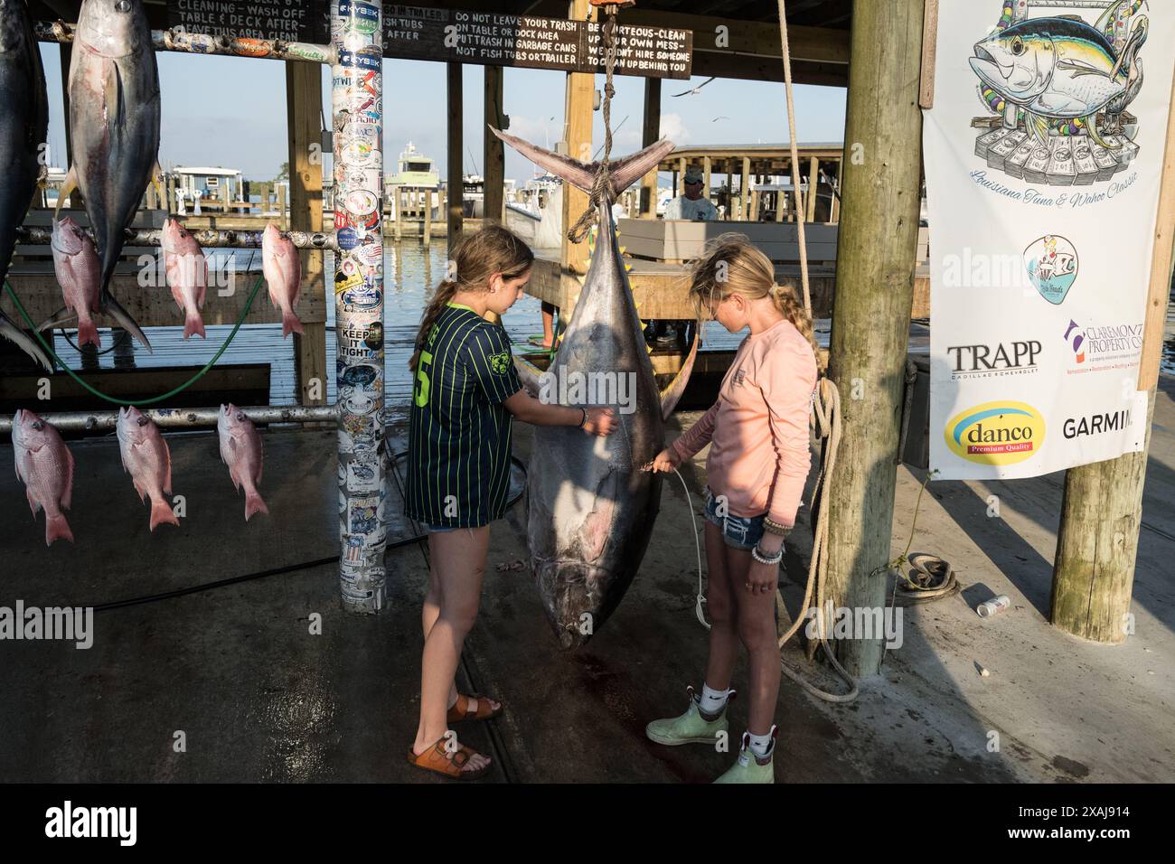 Proud anglers pose with their impressive catch at the end of a ...