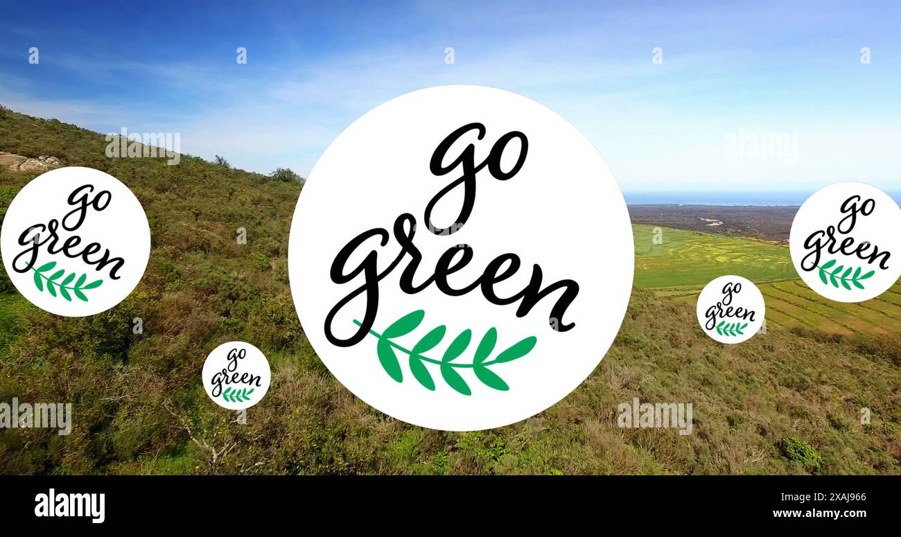 Go green logos with leaf designs are floating over lush, green hillside ...