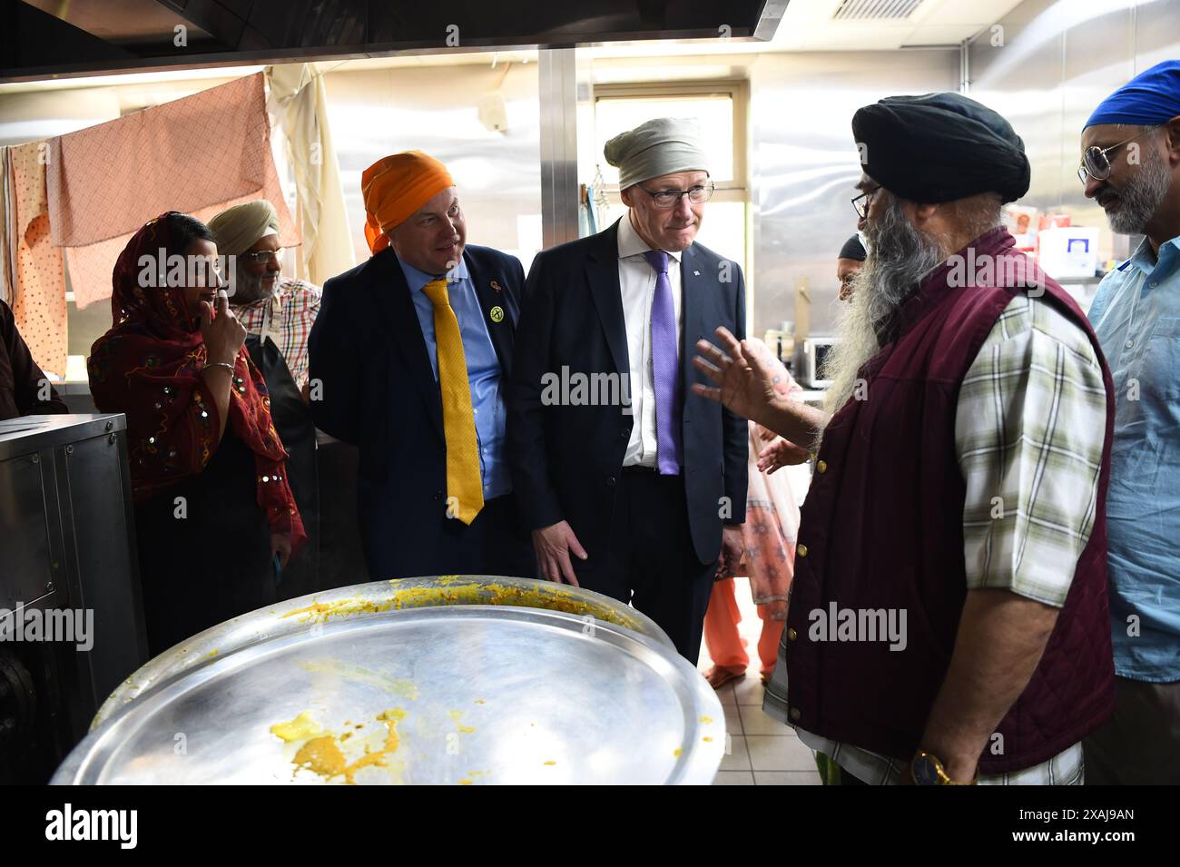 SNP leader John Swinney, with parliamentary candidate Chris Stephens ...