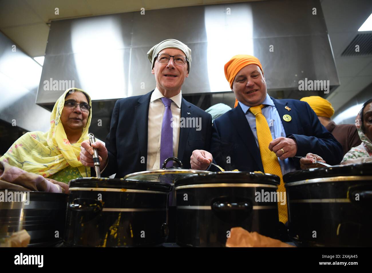 SNP leader John Swinney, with parliamentary candidate Chris Stephens ...
