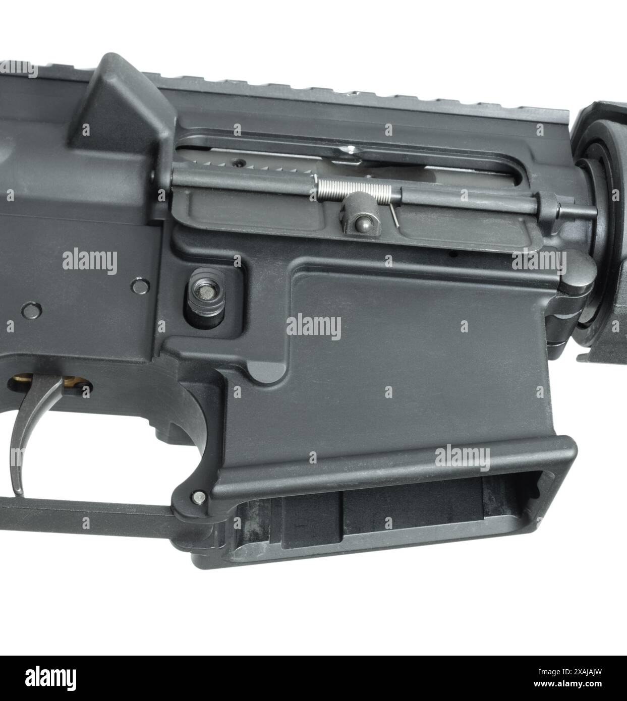 Assault rifle seen up close with its magazine removed to show the empty ...