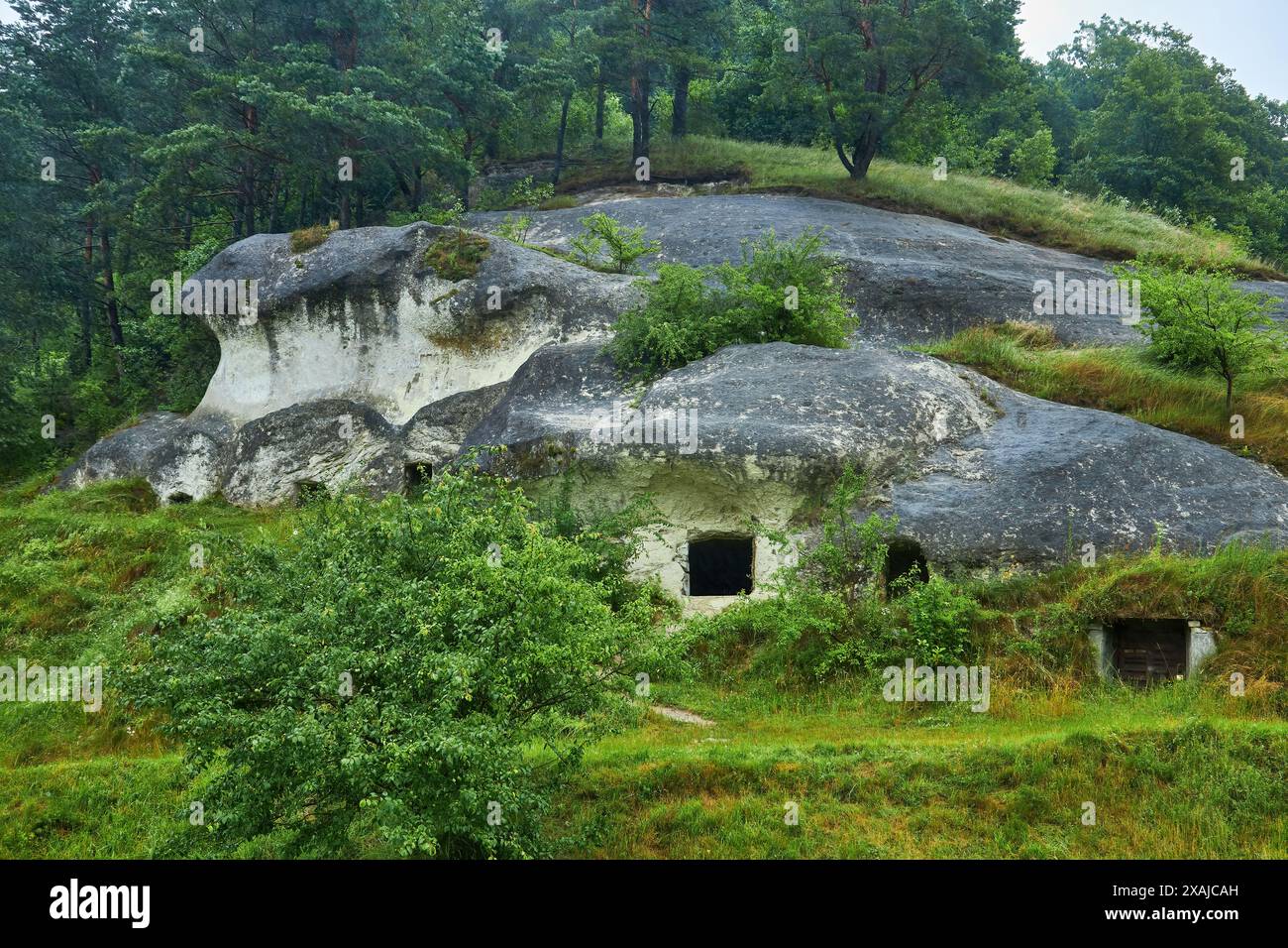 Big old cave houses from outside, rainy weather Stock Photo - Alamy