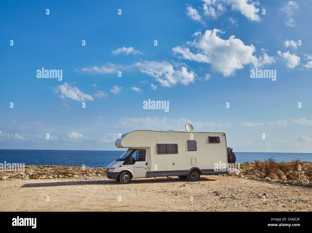 Camper rv caravan on mediterranean coast in Italy. Wild camping on sea ...