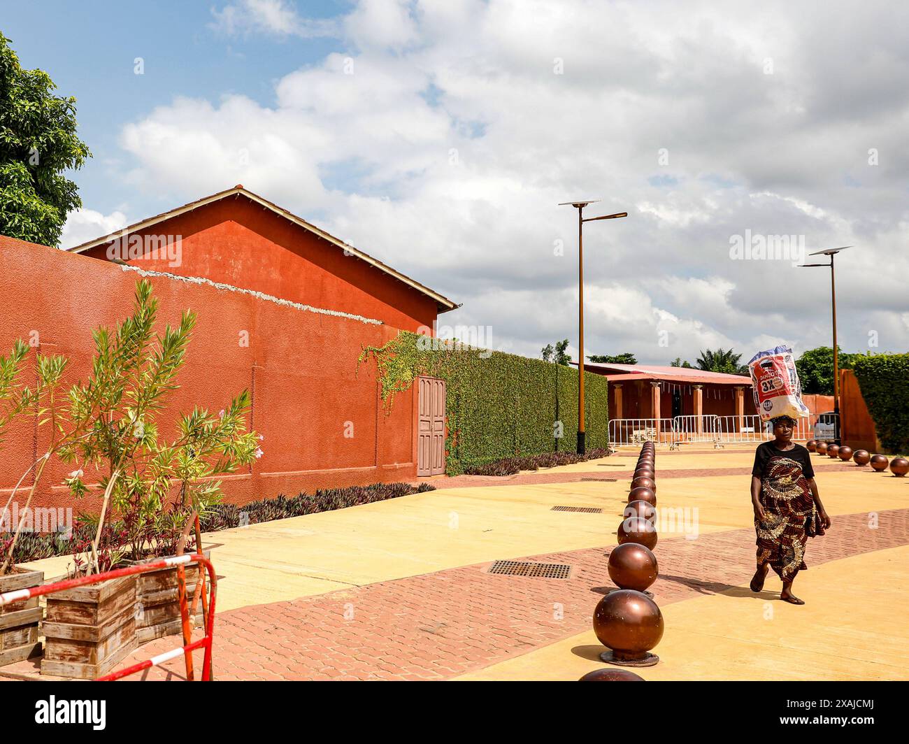 Ouidah. 27th May, 2024. A woman walks through Place Chacha in Ouidah ...