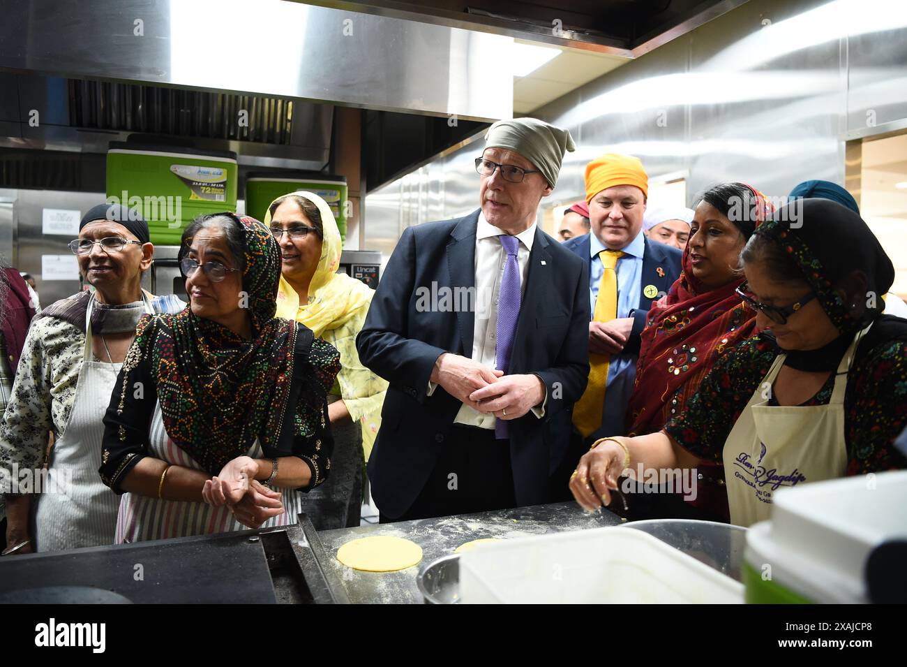 SNP leader John Swinney, with parliamentary candidate Chris Stephens ...